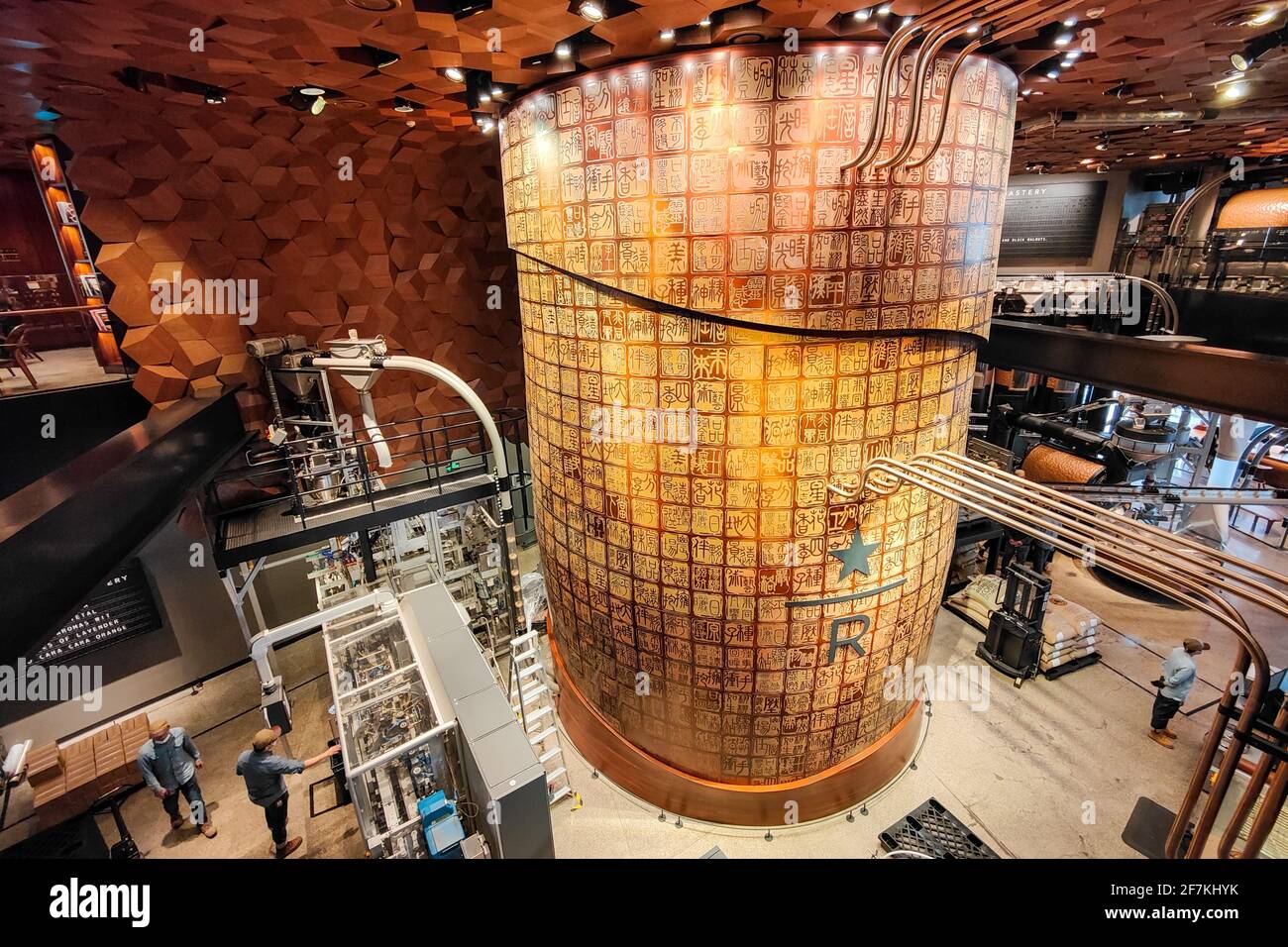 SHANGHAI, CHINA - APRIL 8, 2021 - Staff members work in front of huge ...