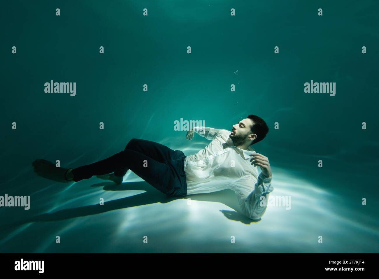 Person underwater in pool hi-res stock photography and images - Alamy