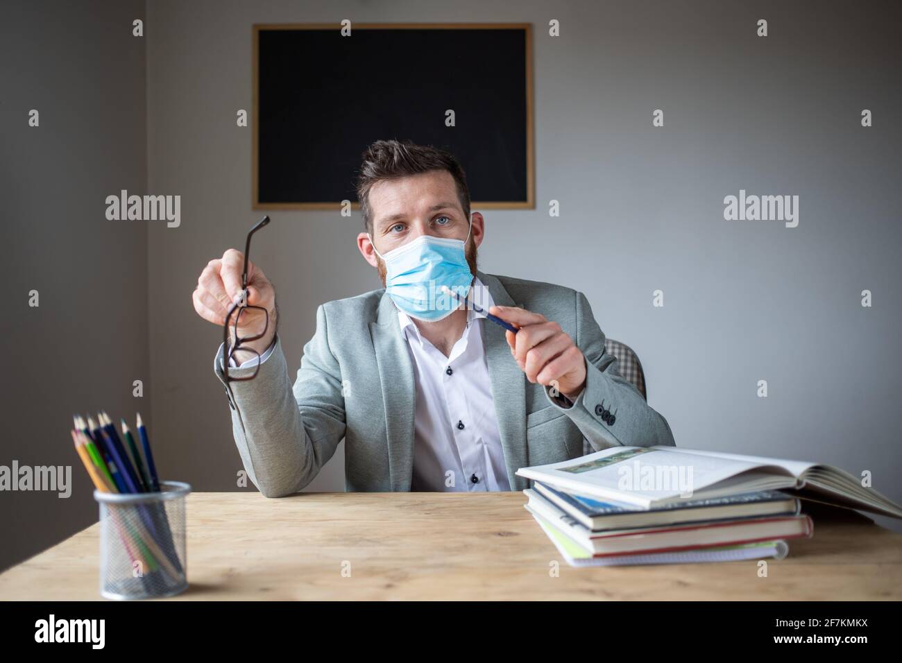 teacher in classroom wearing a medical mask school reopening Stock ...