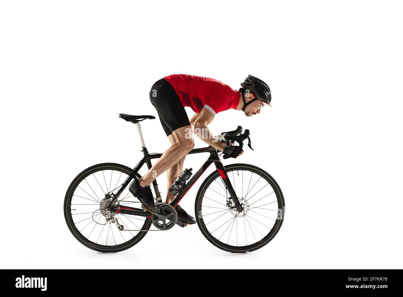 Professional male bike rider with road bike isolated over white ...