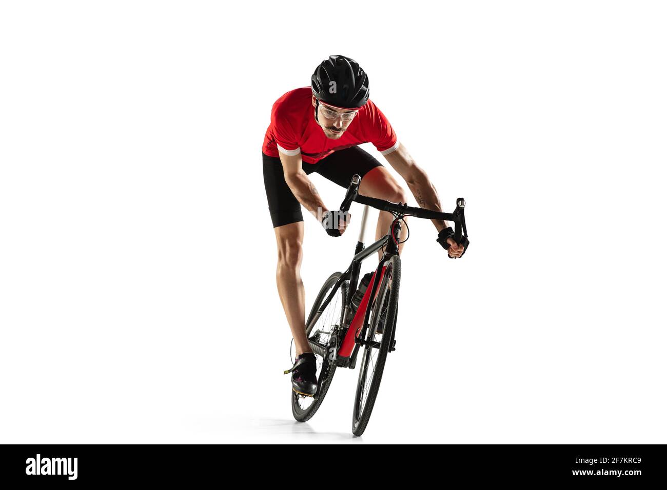 Professional male bike rider on road bike isolated over white ...