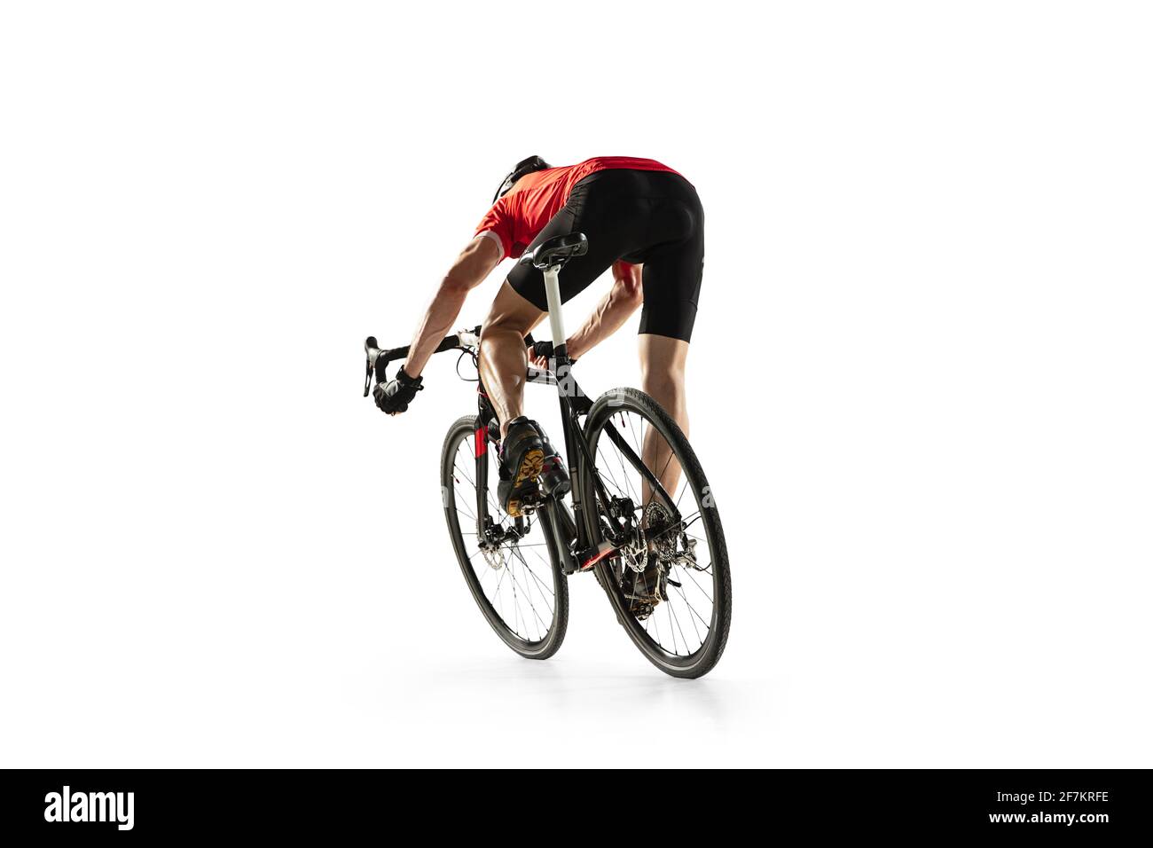 Professional male bike rider with road bike isolated over white ...