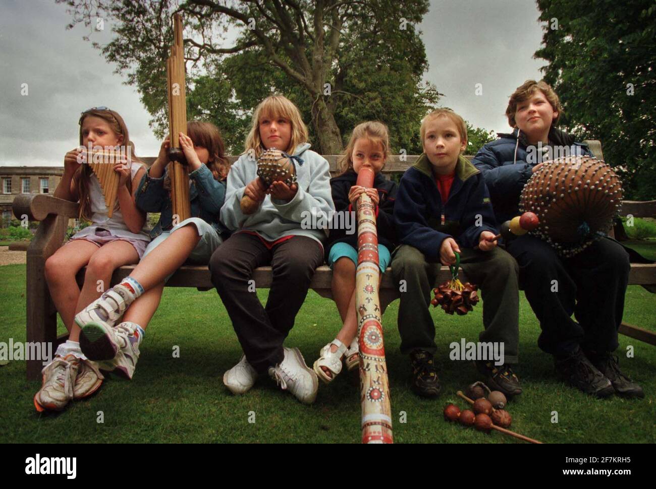 Children playing instruments made from plants August 2000in Oxford ...