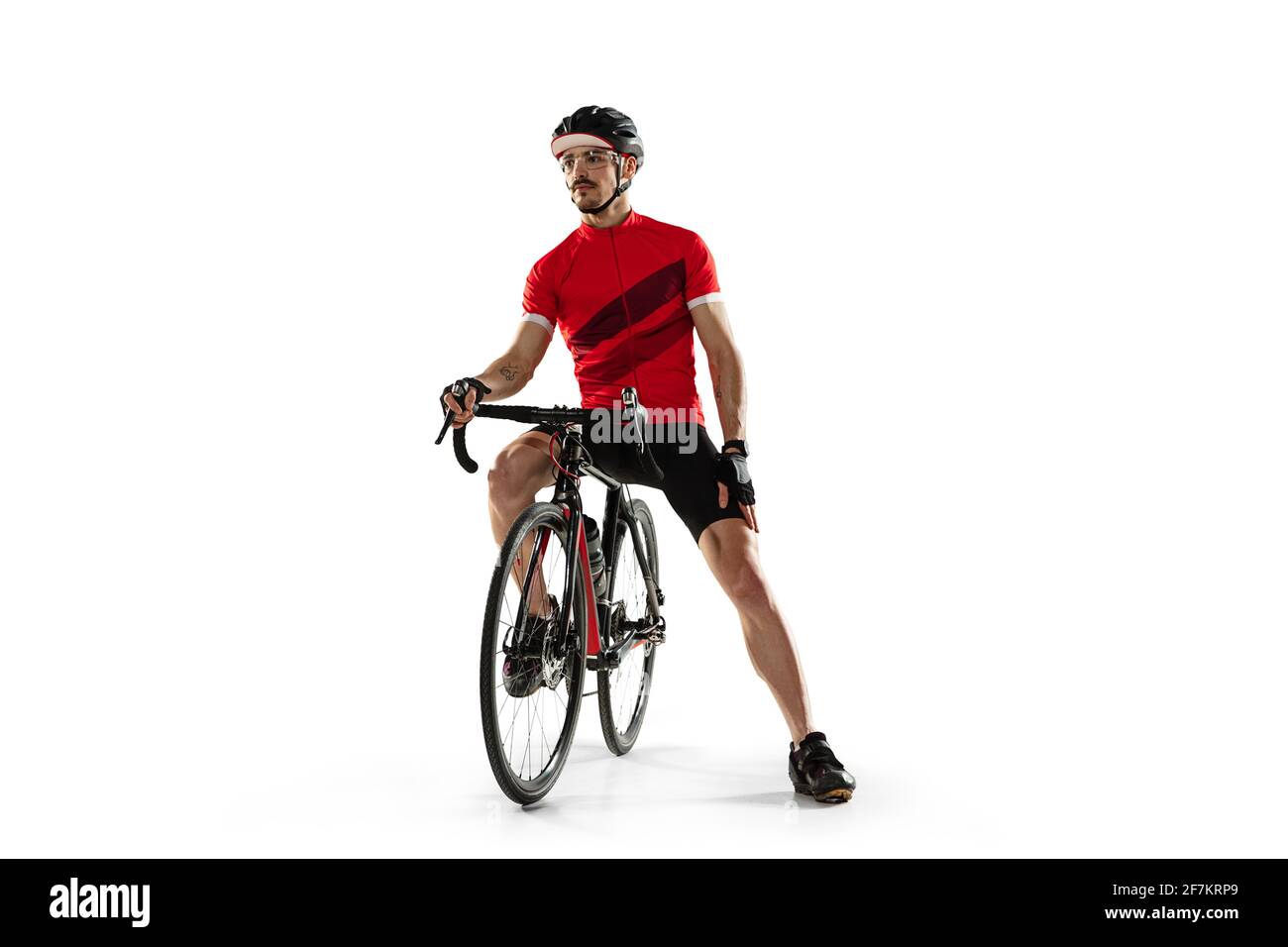Professional male bike rider with road bike isolated over white ...