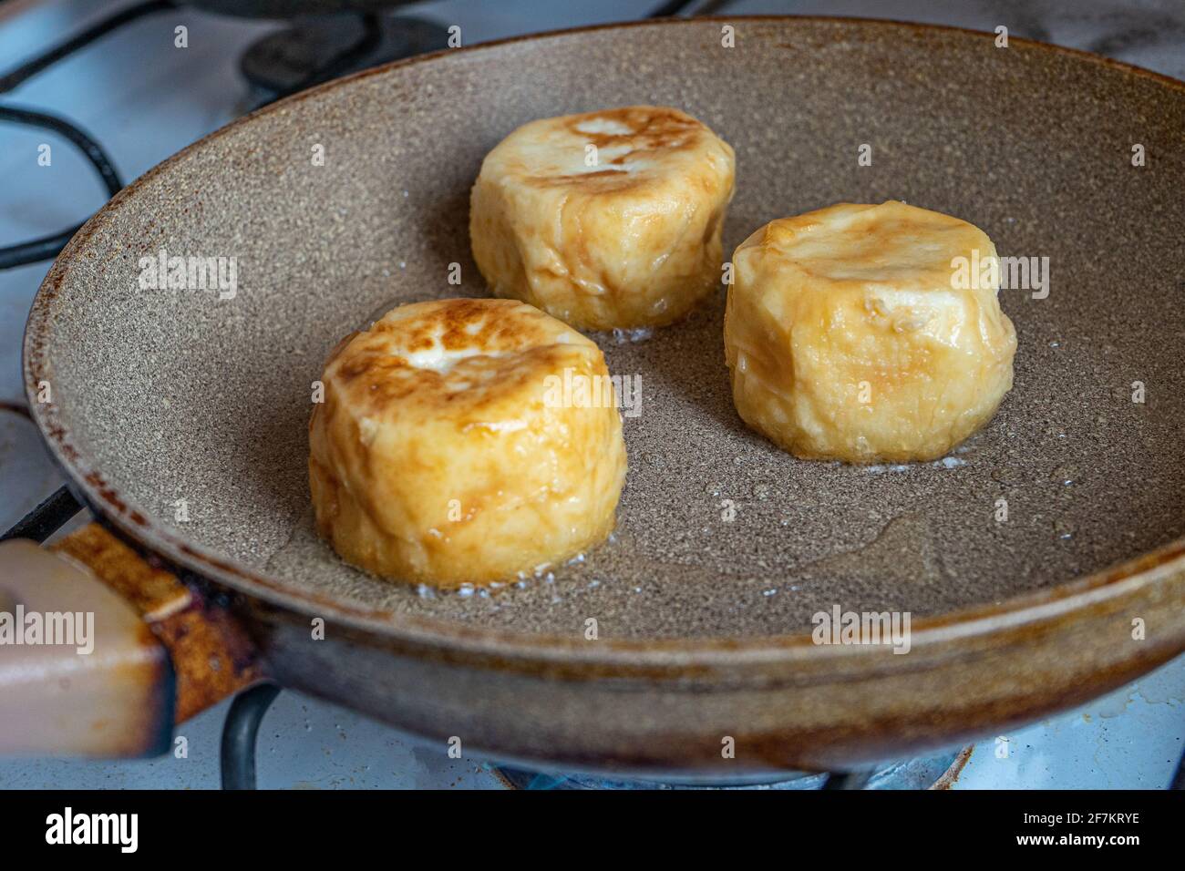 Cottage cheese pancakes, cheesecakes, ricotta fritters fried in a ...