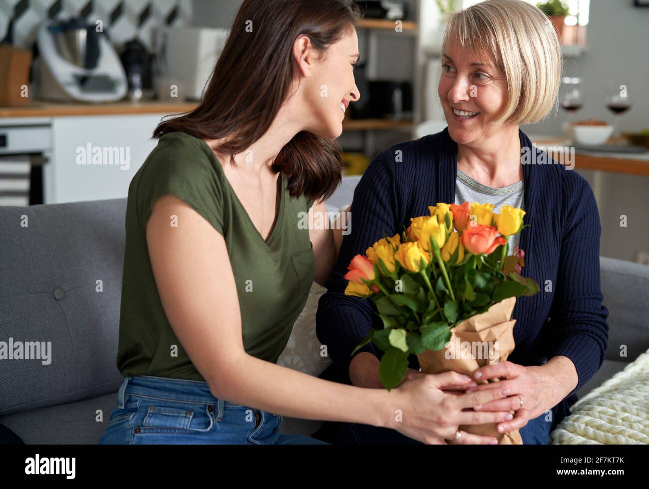 Child giving flowers mother hi-res stock photography and images - Alamy