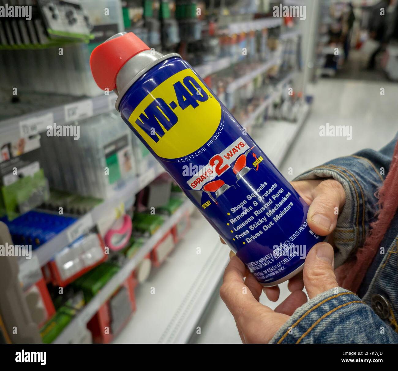A shopper buys a can of WD-40 spray lubricant in a store in New York on ...