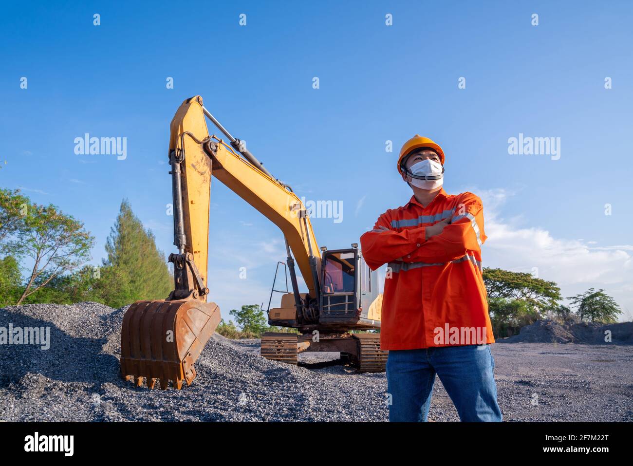 Driver crawler excavator digging in construction site on demolition ...