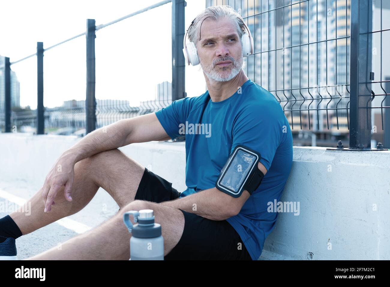 Tired Exhausted Middle-aged Man Resting After Running Outdoors ...