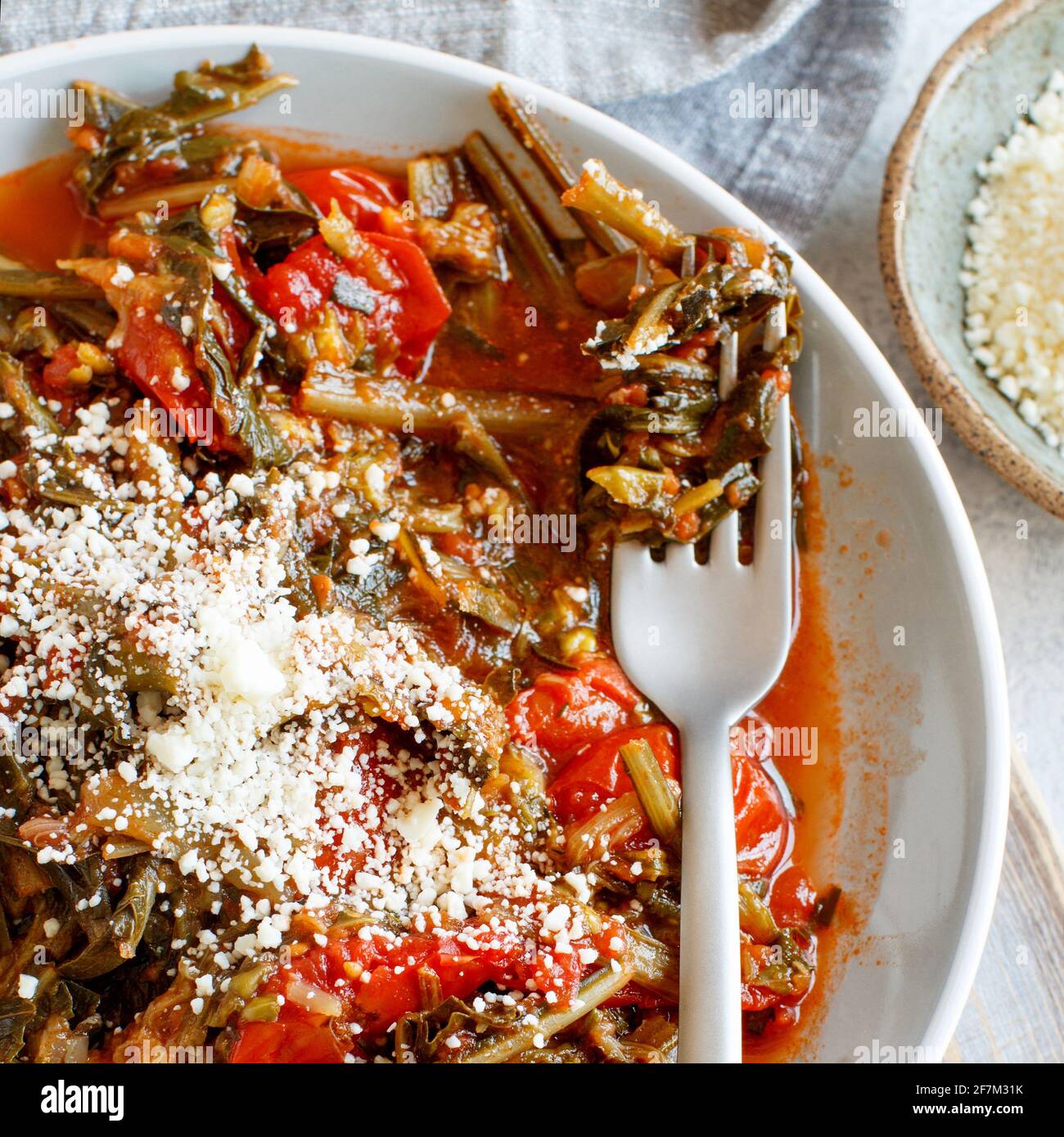 Sauteed green chicory and tomatoes topped with caccioricotta cheese ...