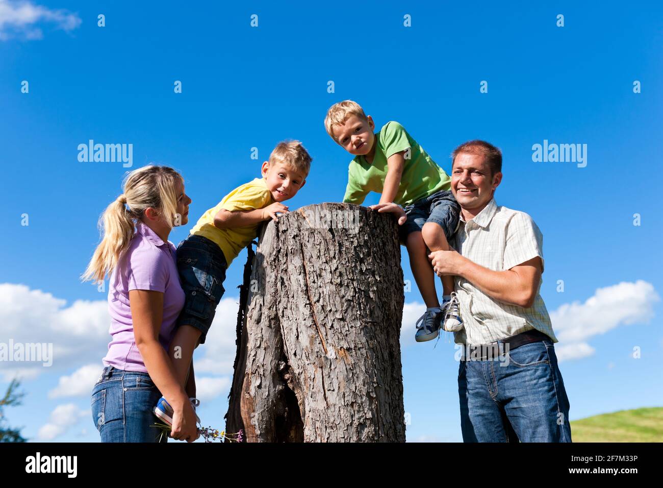 Happy family on excursion in summer - they discovered a trunk Stock ...