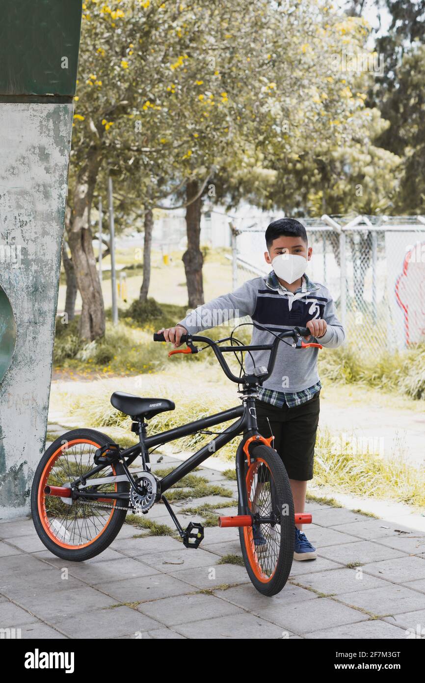 Boy riding his bike through the park enjoying the fresh air Stock Photo ...