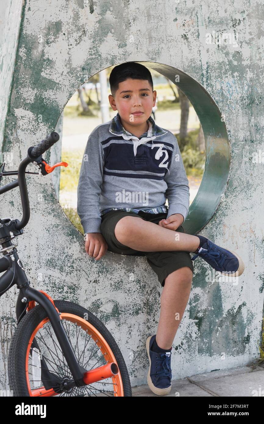 Boy riding his bike through the park enjoying the fresh air Stock Photo ...
