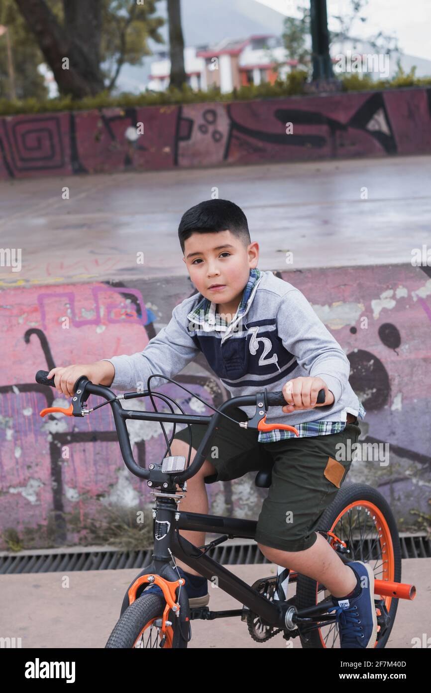 Boy riding his bike through the park enjoying the fresh air Stock Photo ...