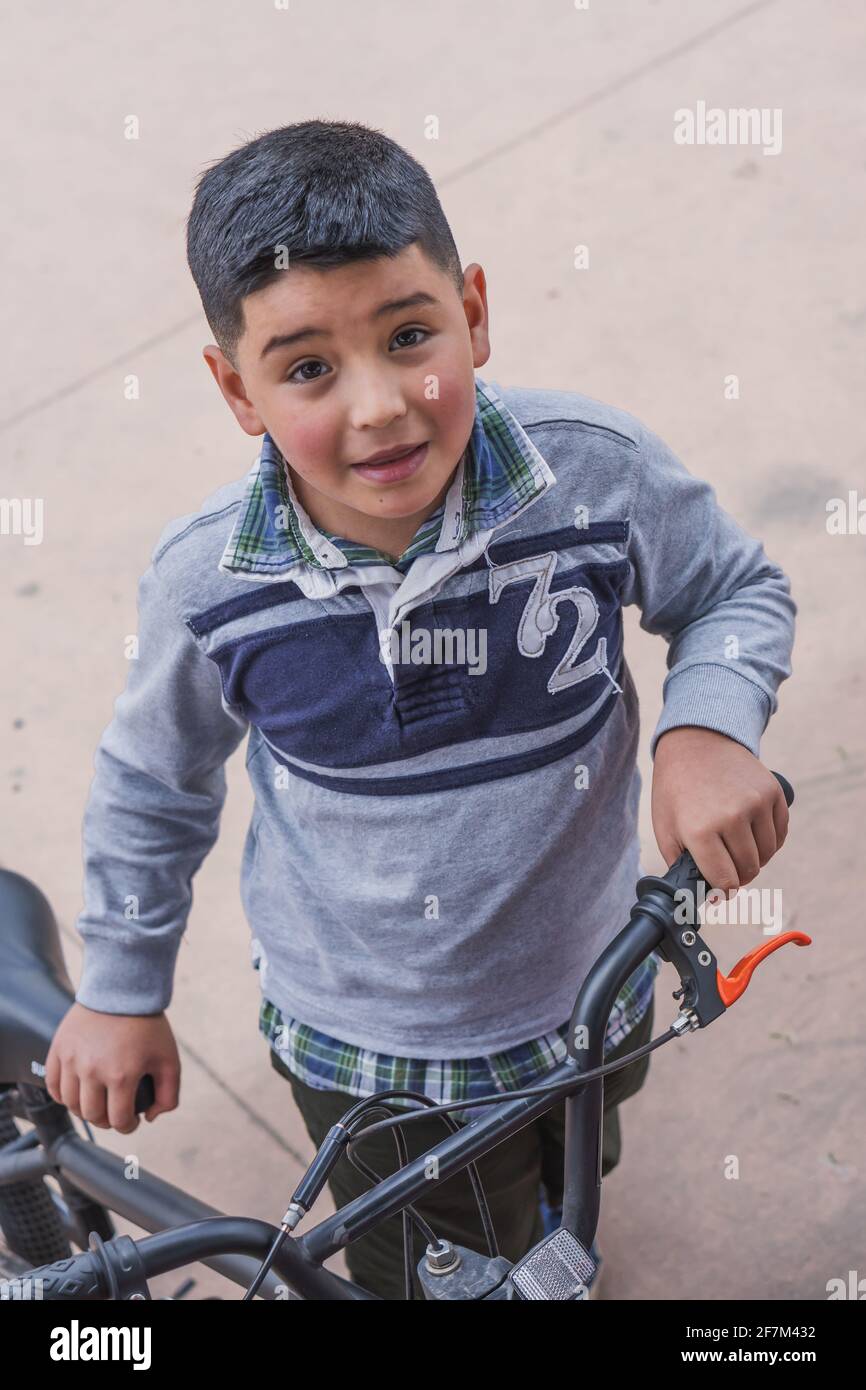 Boy riding his bike through the park enjoying the fresh air Stock Photo ...