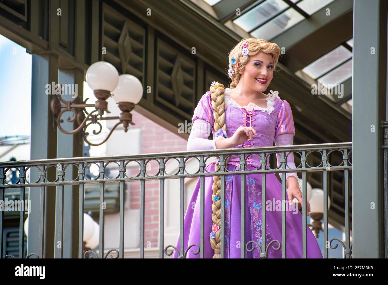 Orlando, Florida. August 04, 2020. Rapunzel waving from the balcony at ...