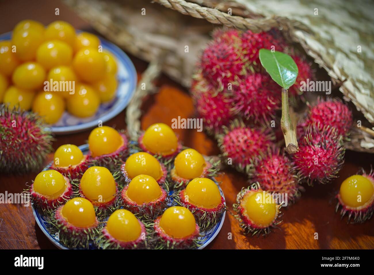 Wild Rambutan with yellow flesh Stock Photo - Alamy
