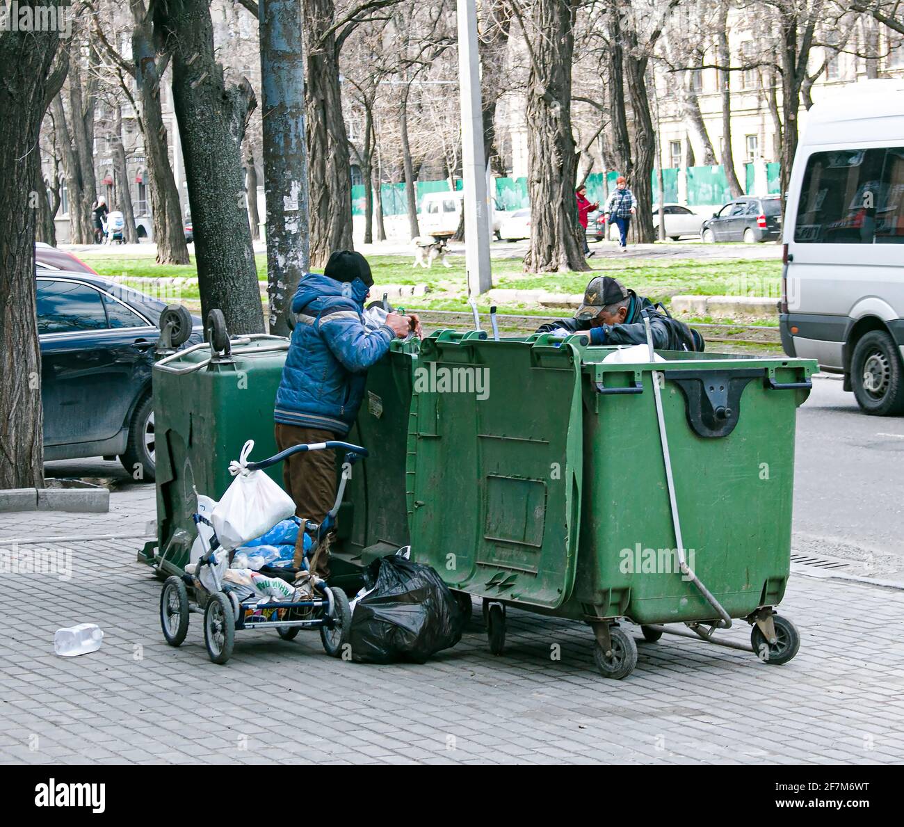 Poor rummaging in the garbage hi-res stock photography and images - Alamy