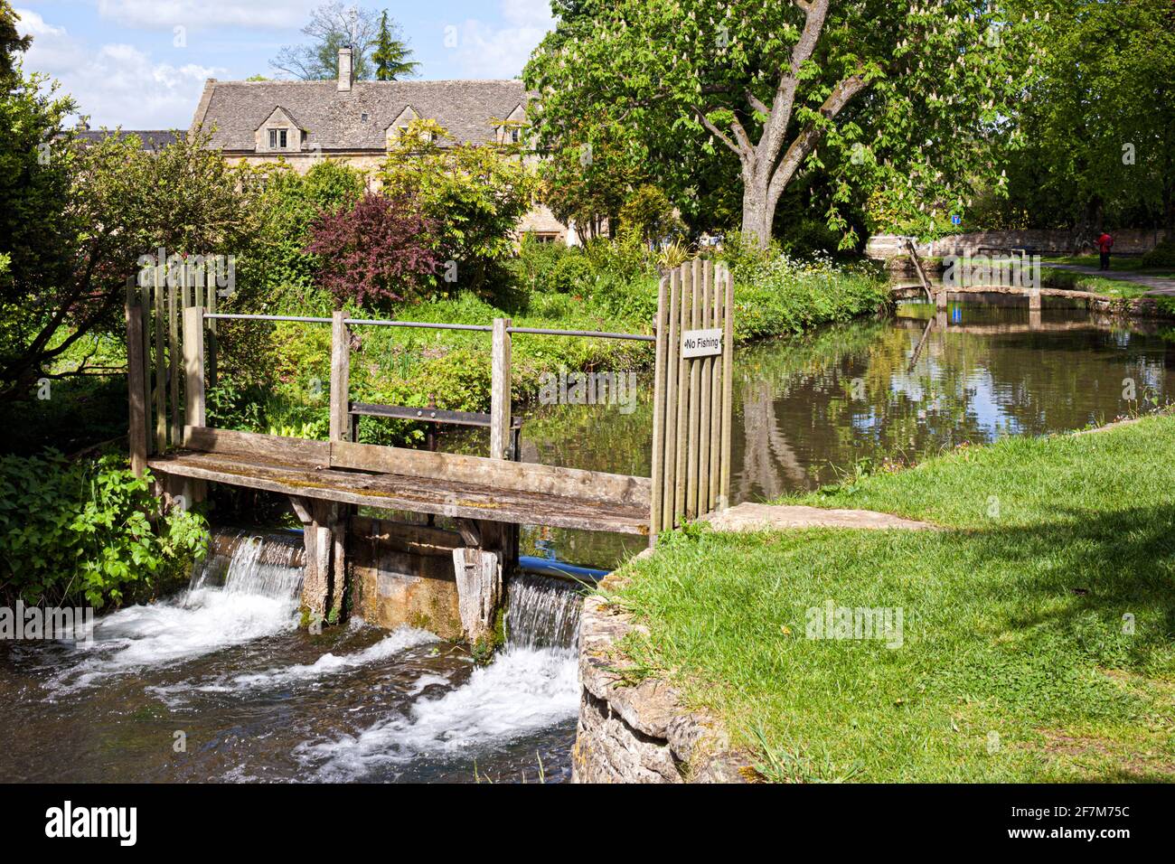 The River Eye flowing through the Cotswold village of Lower Slaughter ...
