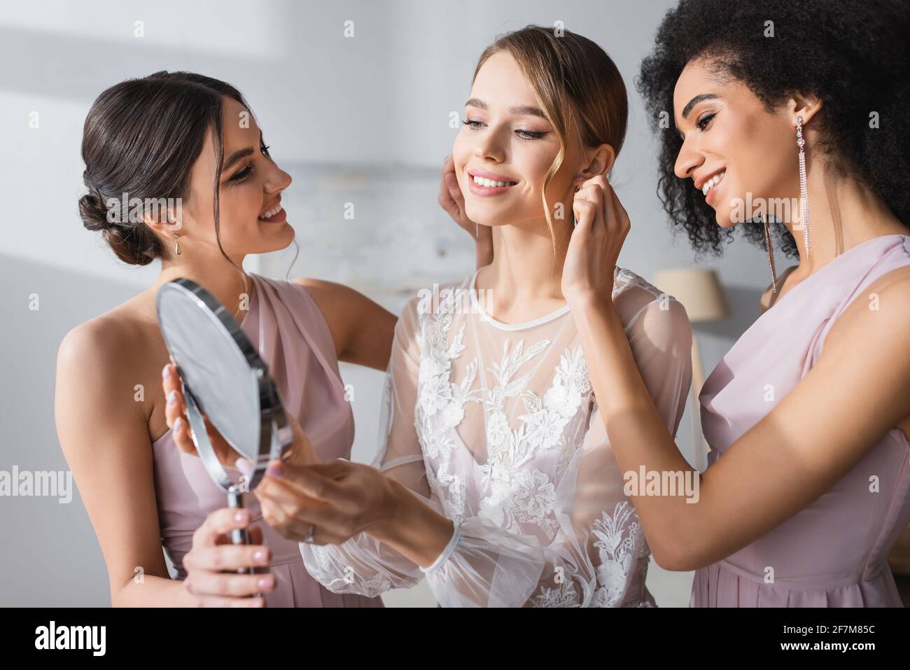 Bride looking into mirror hi-res stock photography and images - Alamy