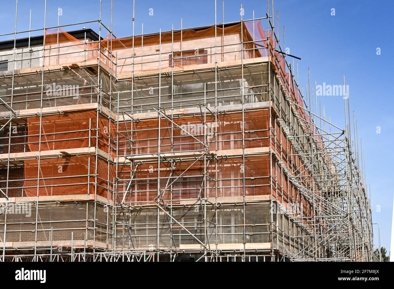 Scaffolding around the outside of a new block of flats under ...