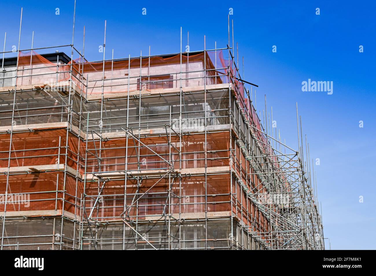 Scaffolding around the outside of a new block of flats under ...