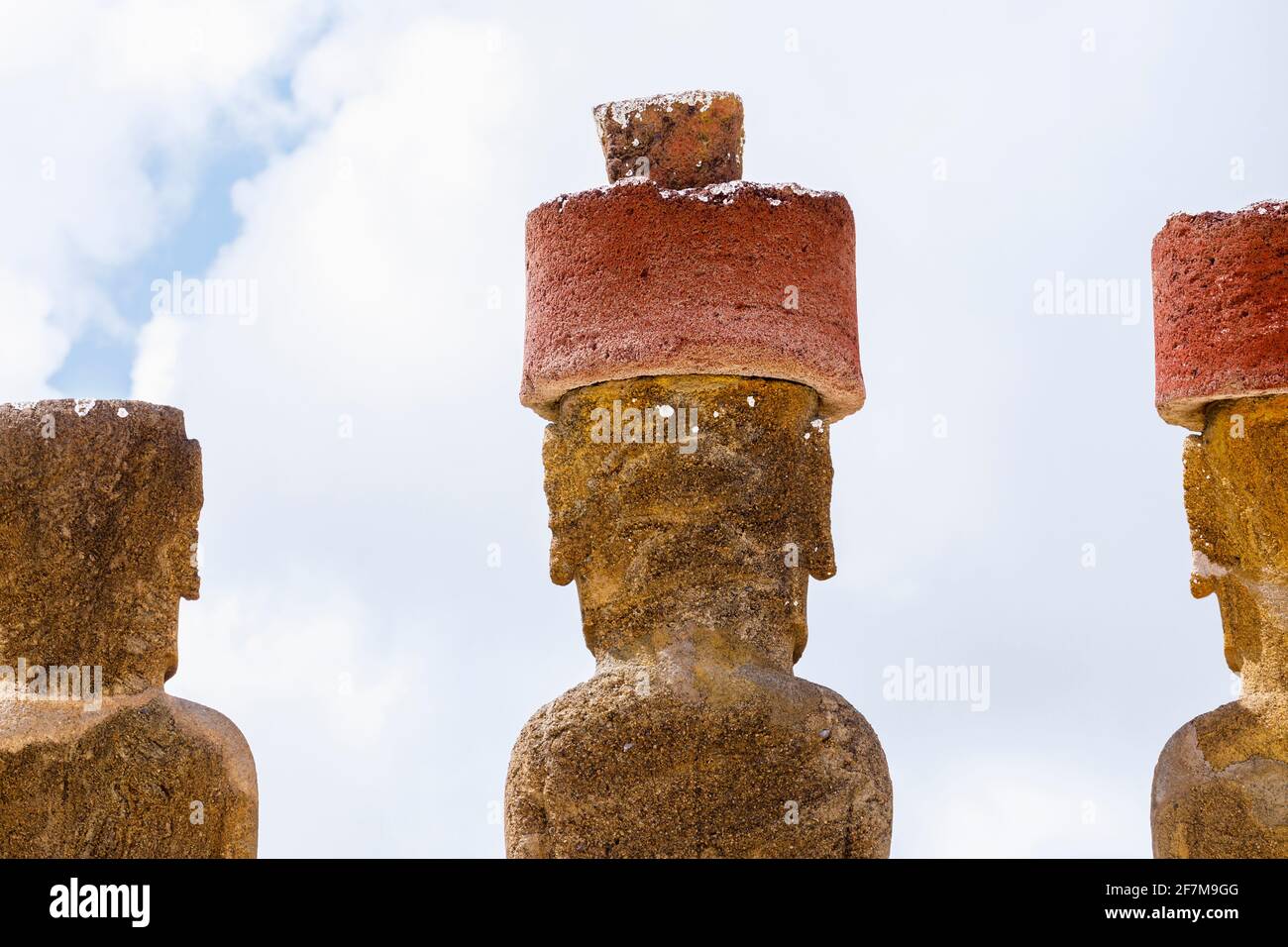 Rear view of the heads of restored moai with red scoria topknots (pukao ...