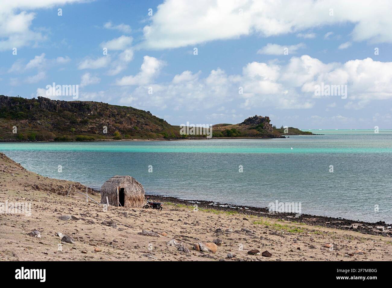 Small traditional house of a fisherman made from straw, in a secluded ...
