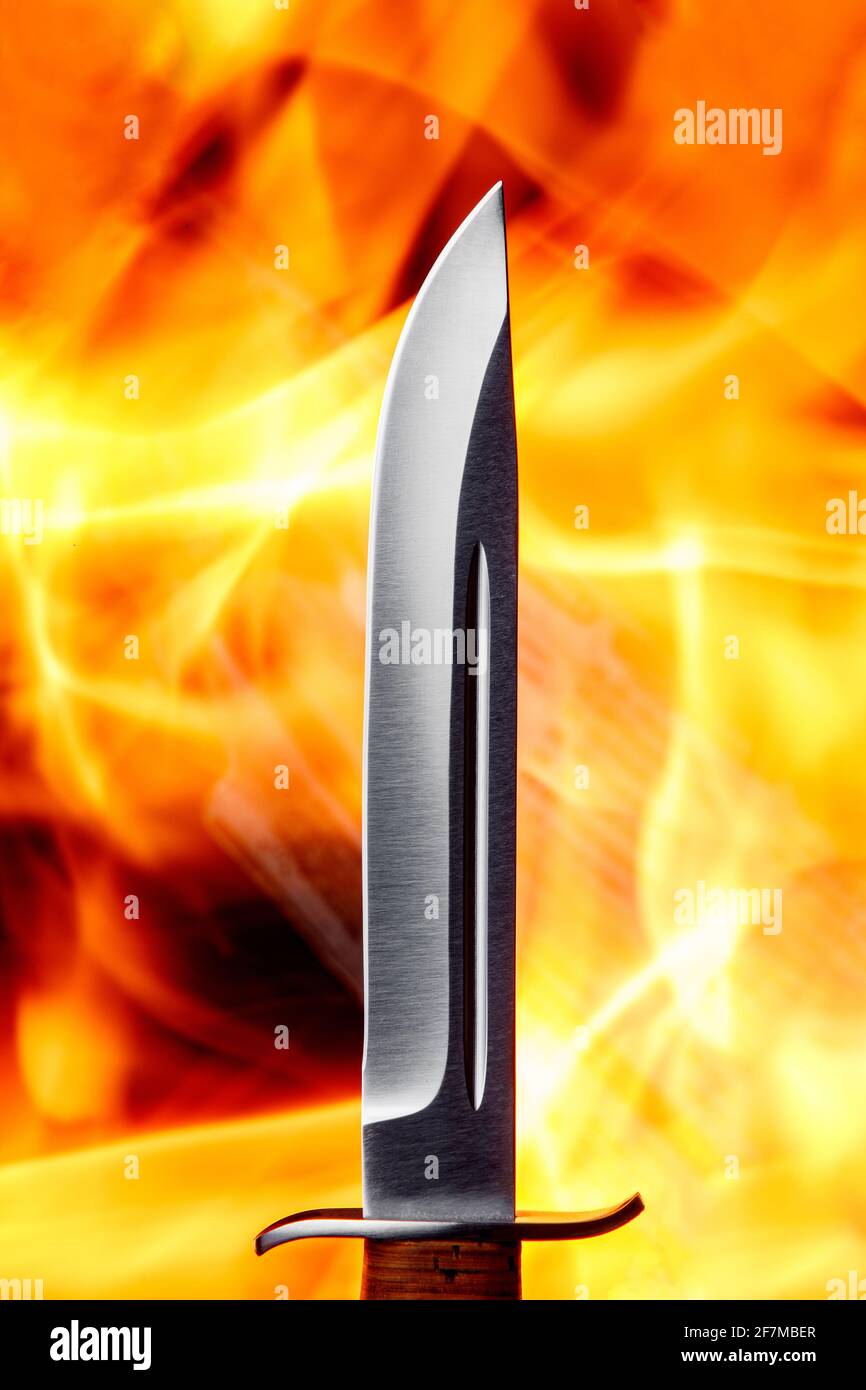 Knife on the fire background Stock Photo - Alamy