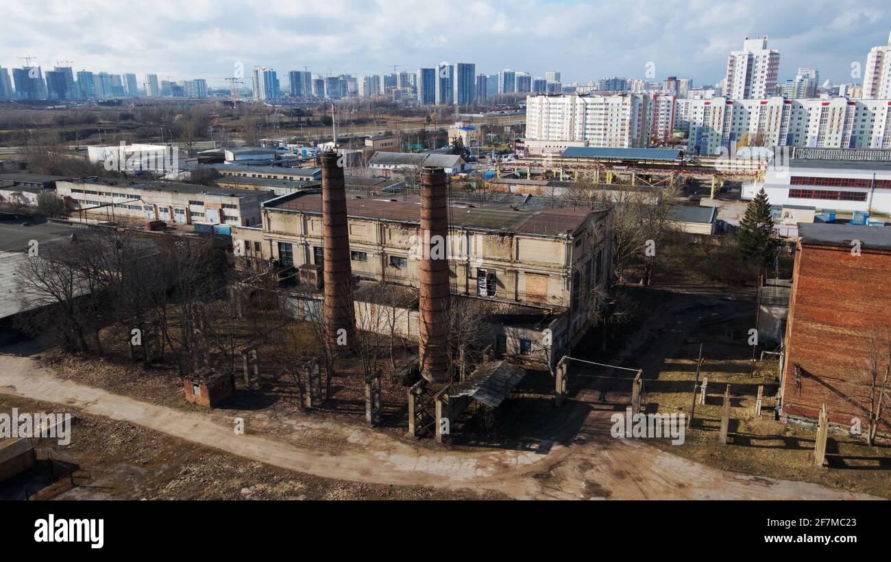 Abandoned industrial area. Old brick buildings and factory chimneys ...