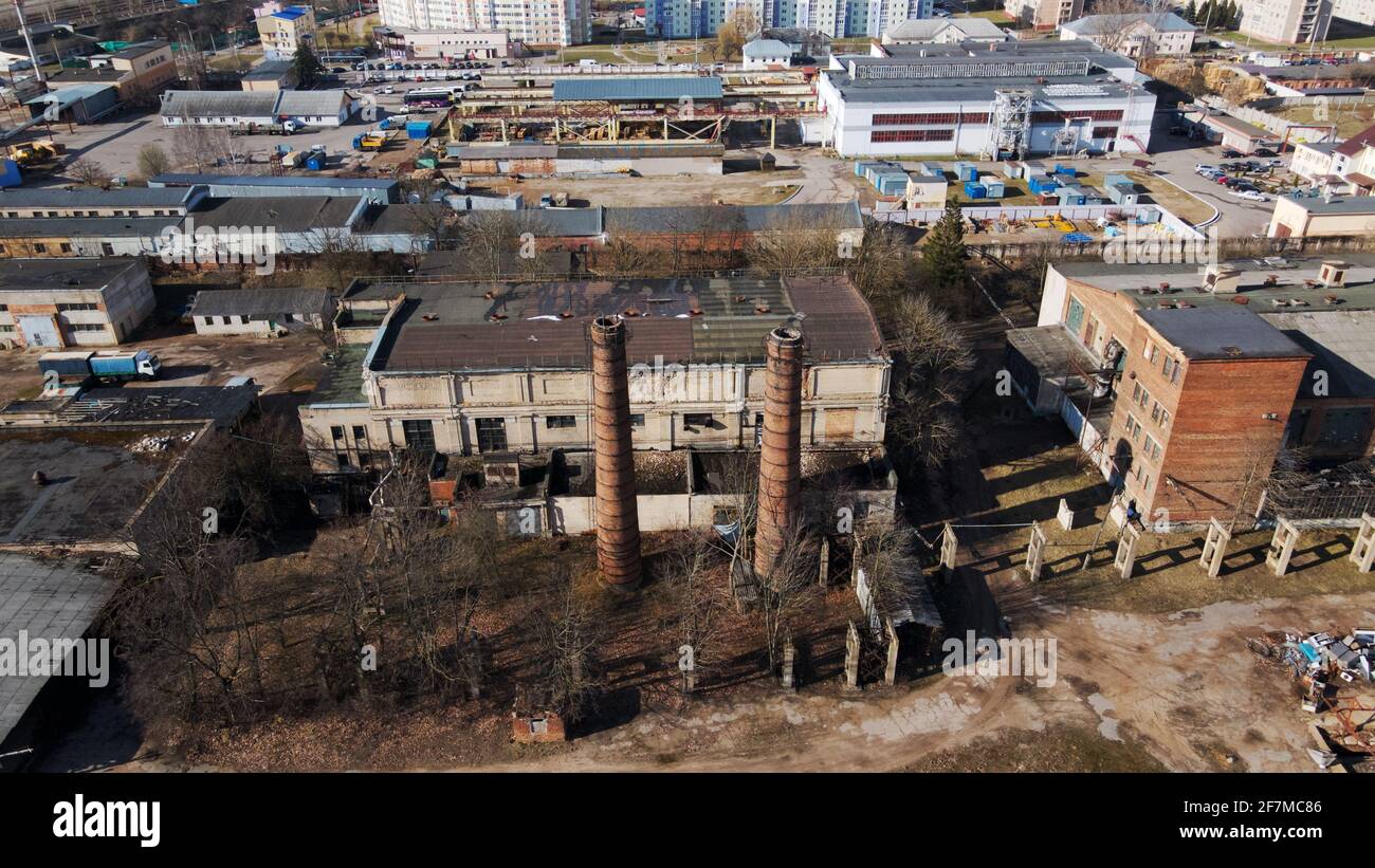 Abandoned industrial area. Old brick buildings and factory chimneys ...