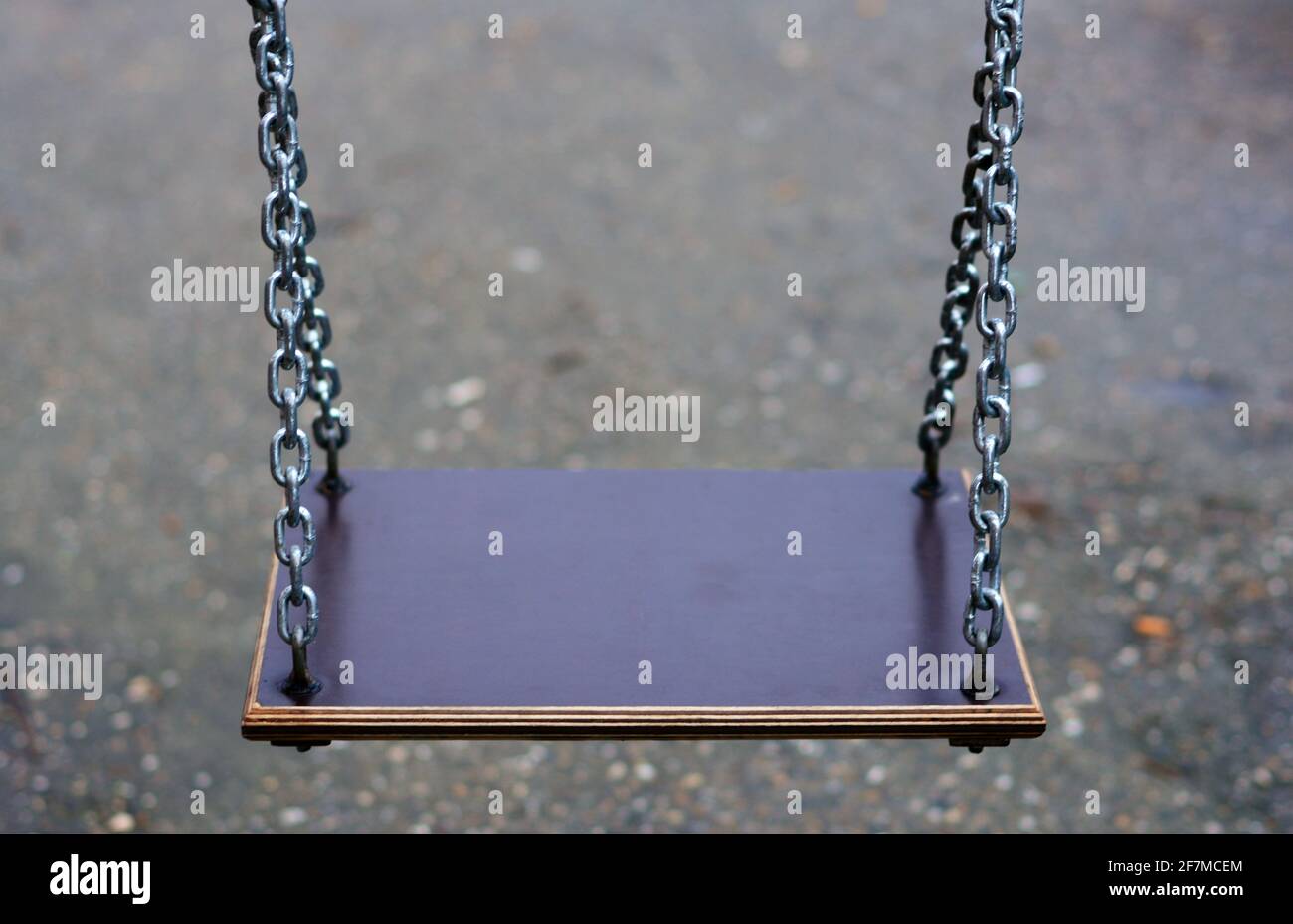 Swing in a playground summer a swing hanging seat hi-res stock ...