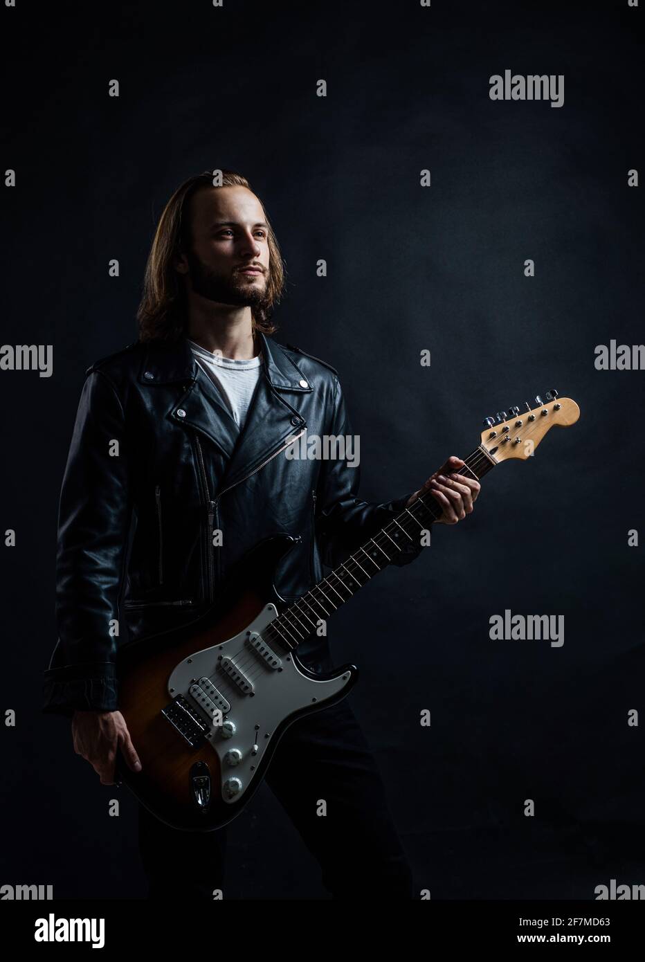 cool. masterfully playing rock music. stylish crazy man. string musical ...