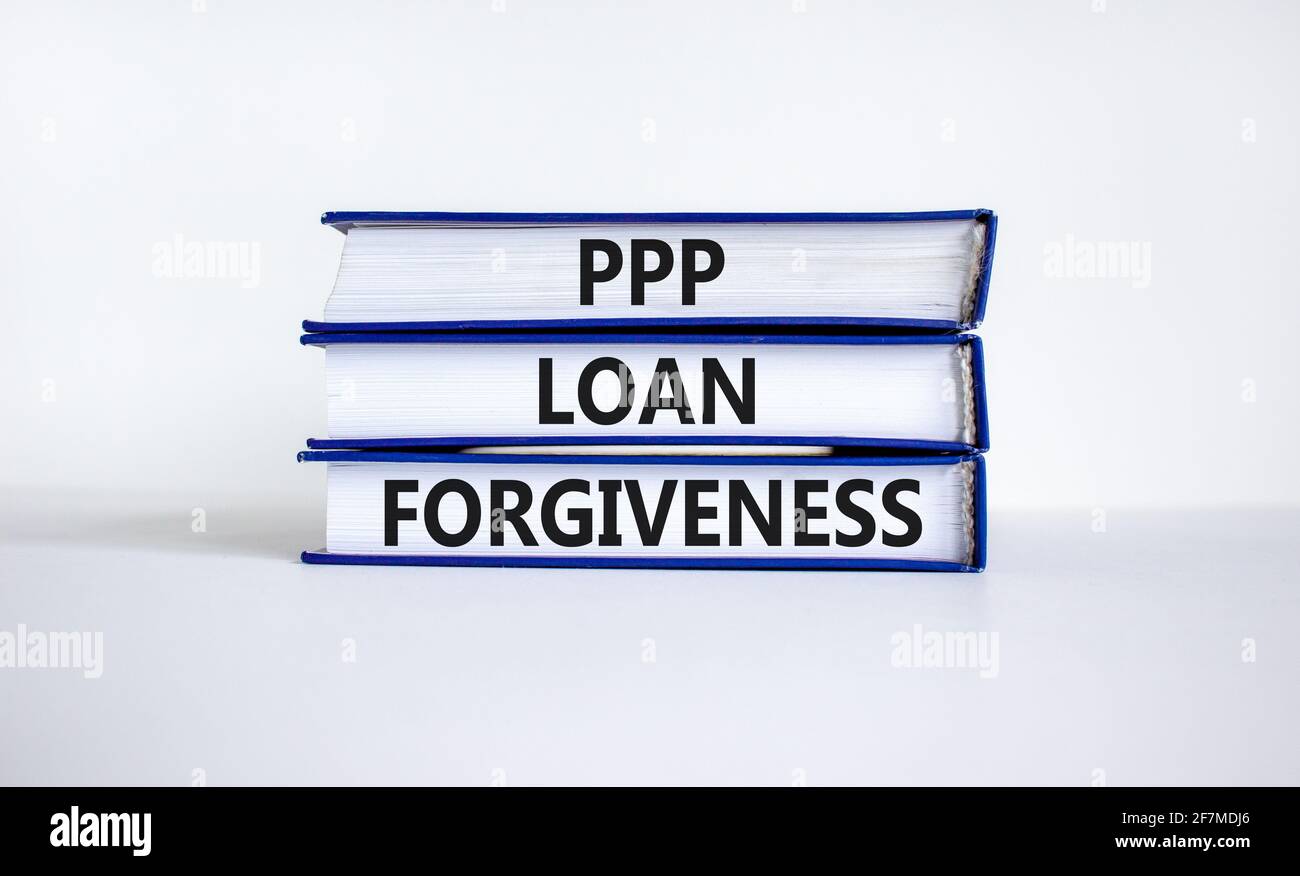 PPP, paycheck protection program loan forgiveness. Concept words PPP loan forgiveness on books ...