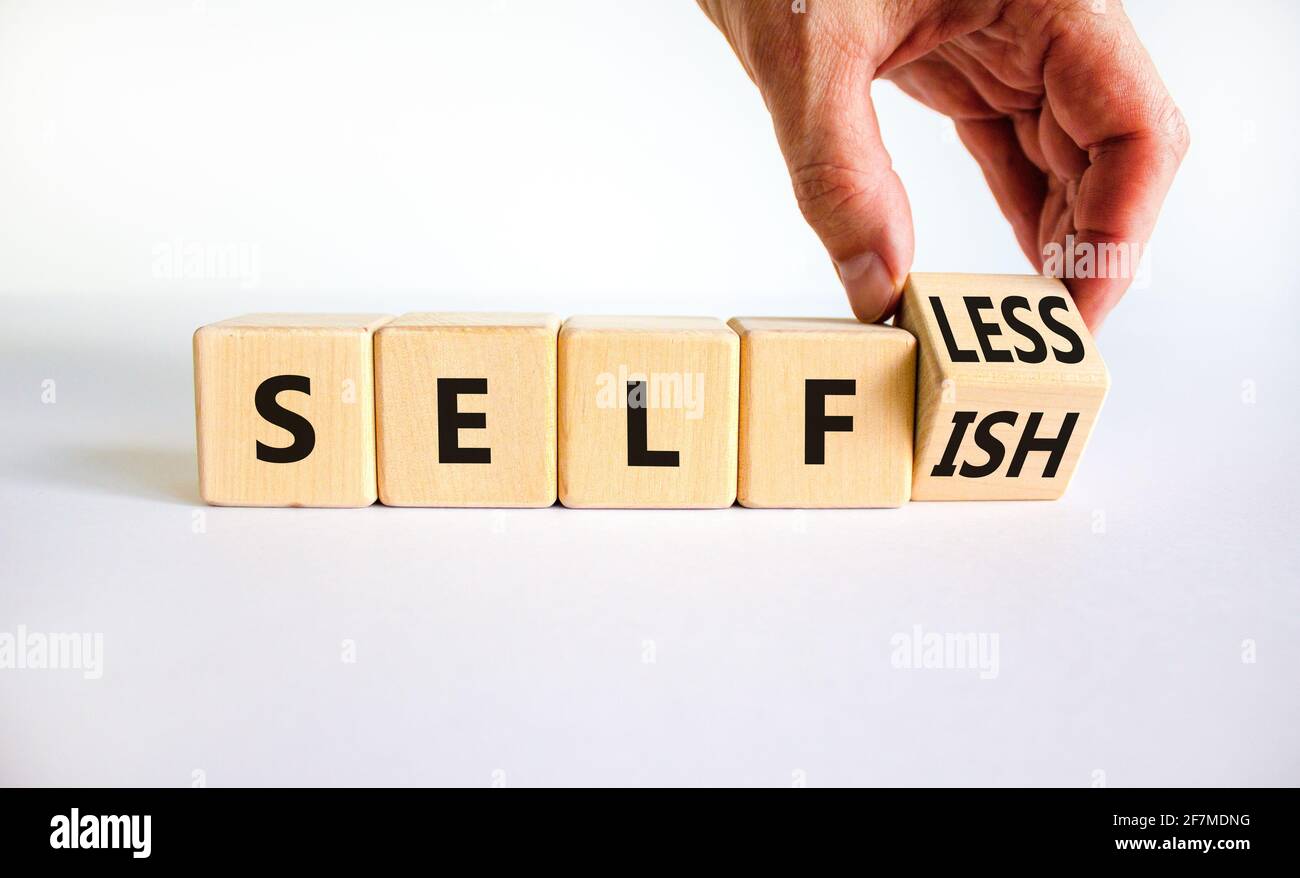 Selfish or selfless symbol. Businessman turns cubes and changes the ...