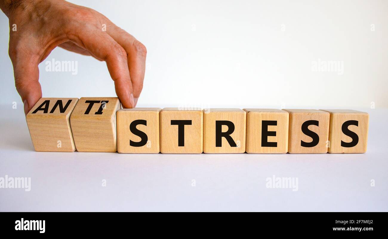 Antistress vs stress symbol. Doctor turns cubes and changes the word ...