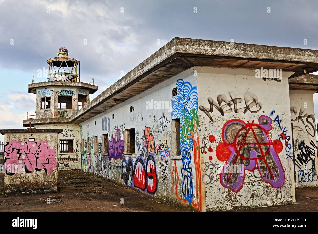 Graffiti on side of buildings and lighthouse Stock Photo - Alamy