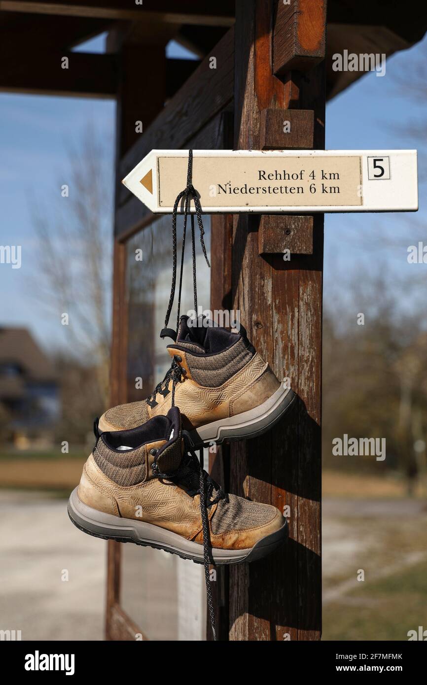 Shoes hang on street sign hi-res stock photography and images - Alamy