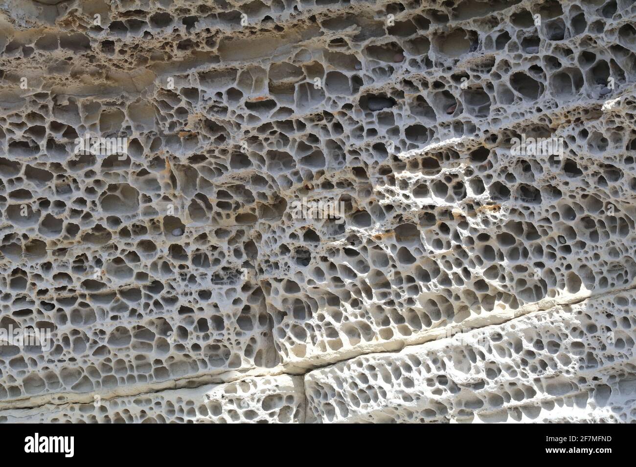 Closeup of honeycomb erosion on cliffs at Elgol, Isle of Skye, Scotland ...