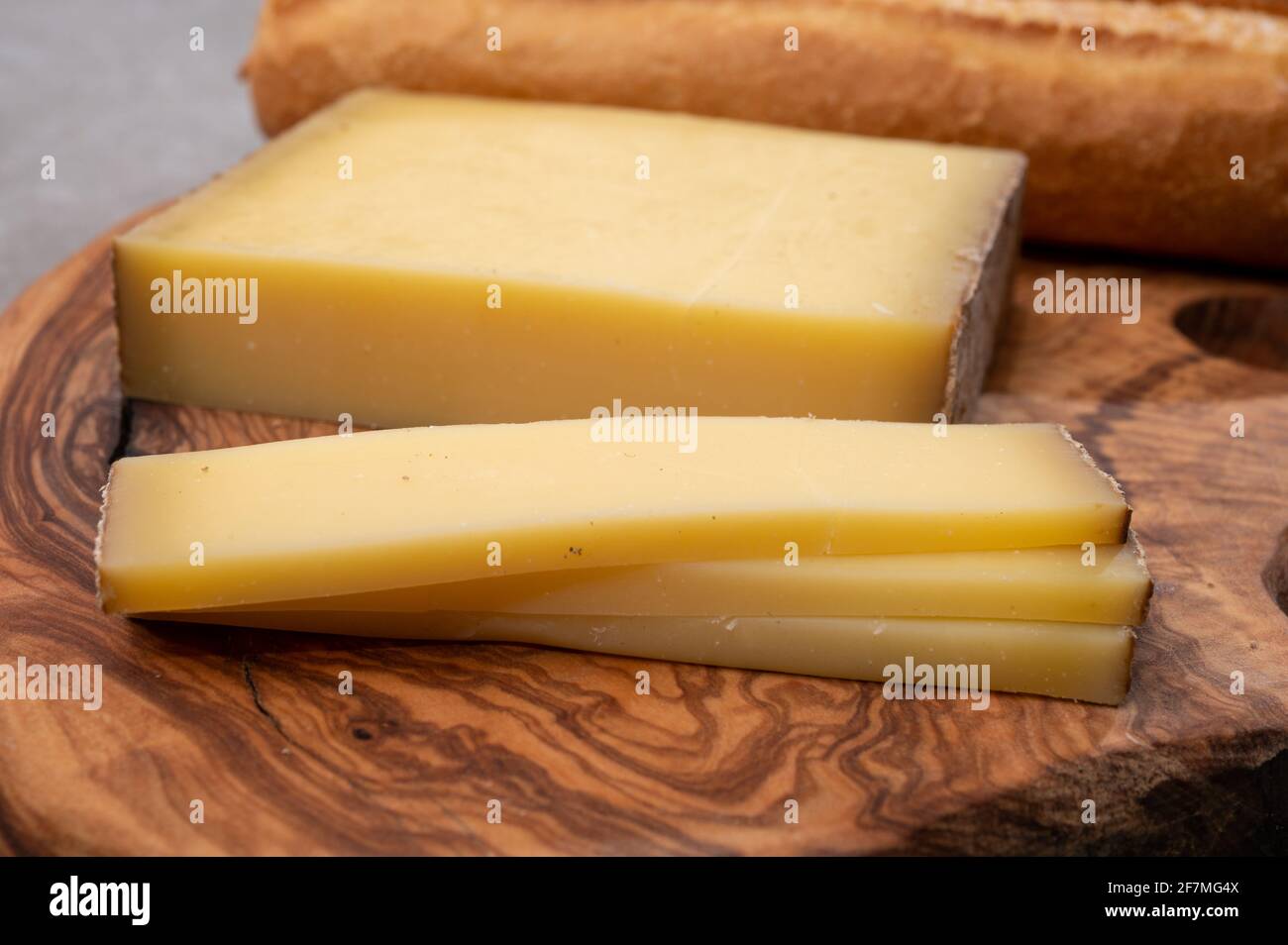 French food - piece of cheese comte made from cow milk in region ...