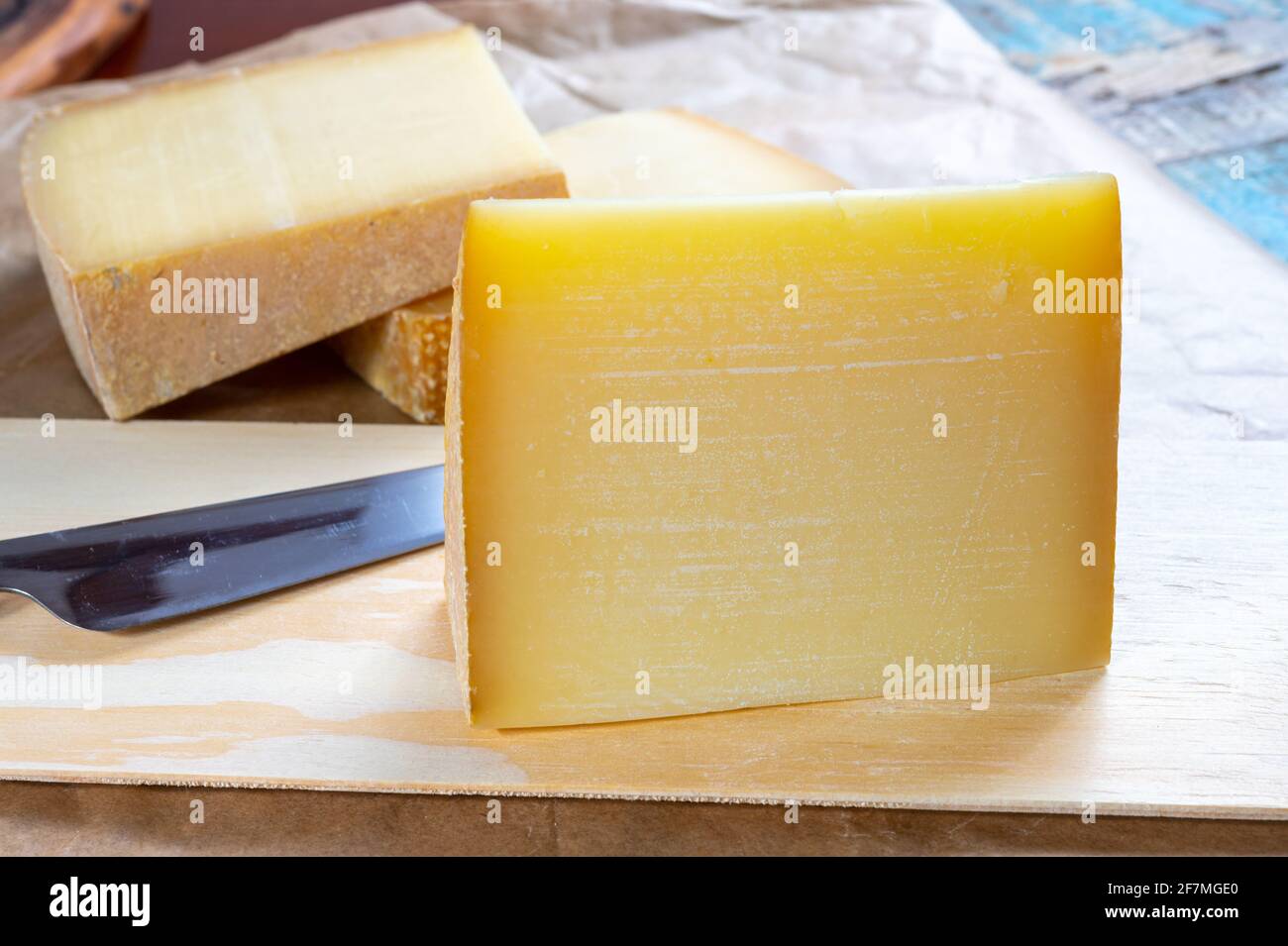 Cheese collection, French comte and Swiss gruyere cheeses close up ...