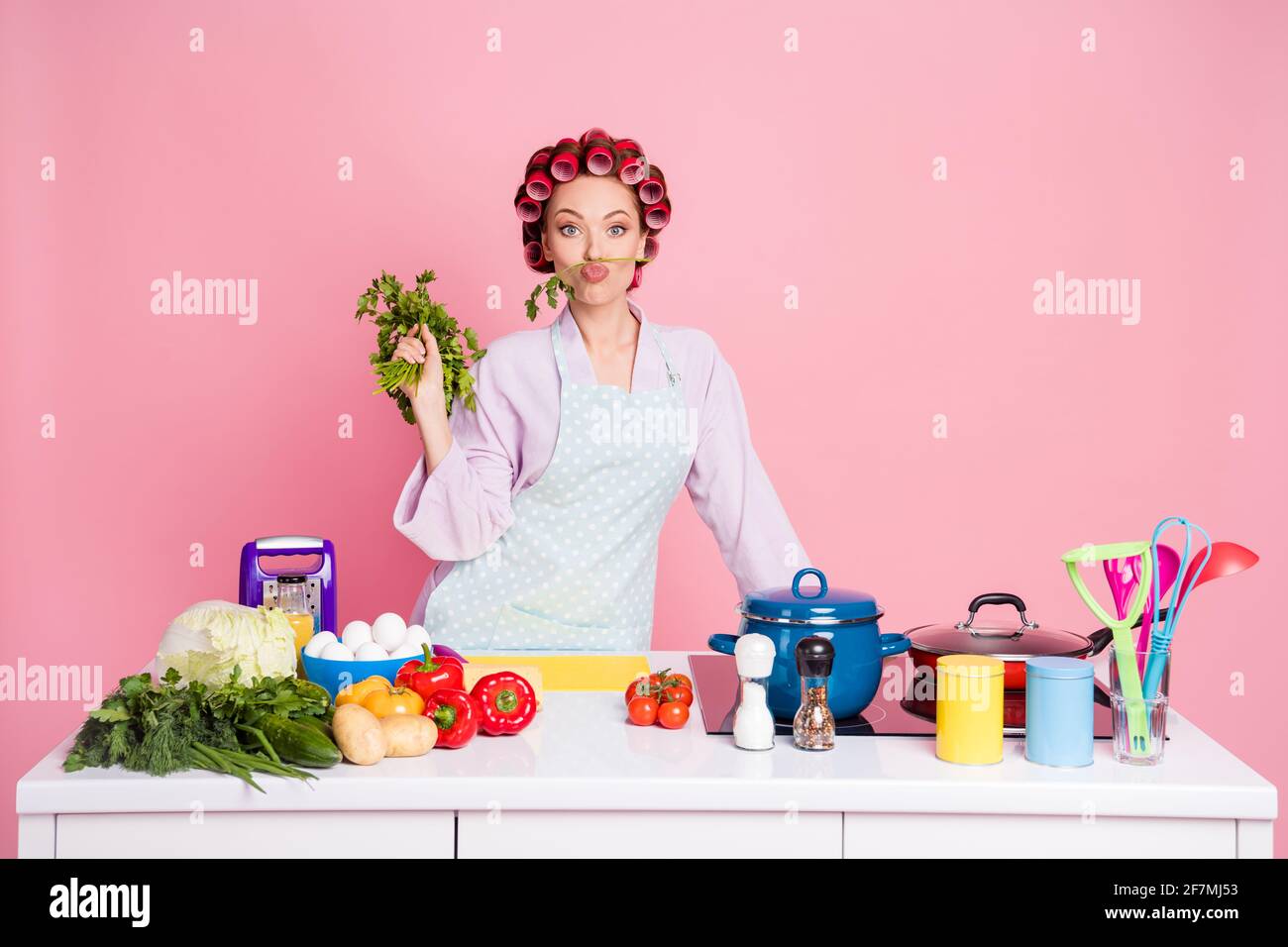 Photo of positive charming lady put vegetable on lips kiss good mood ...