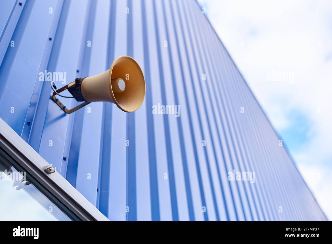 Megaphone hanging on the wall with copy space Stock Photo - Alamy