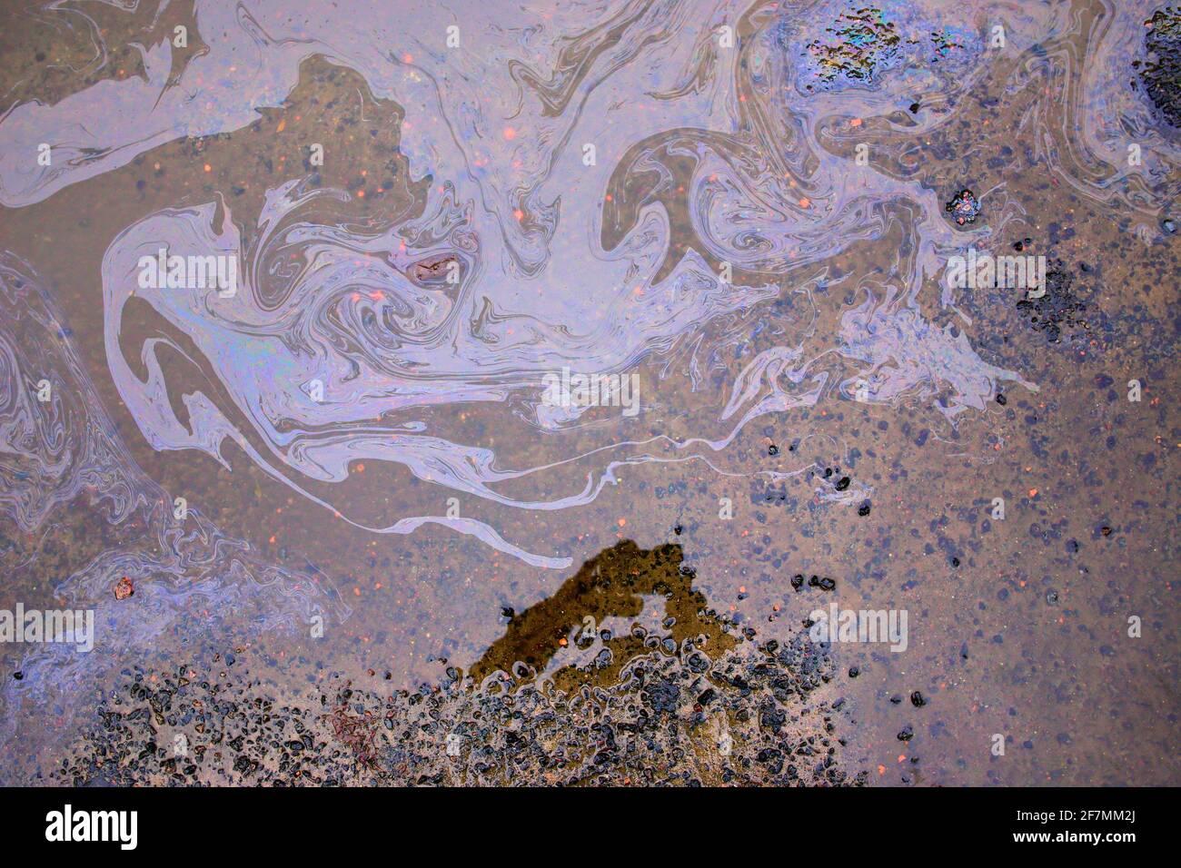 Oil rainbow in puddle hi-res stock photography and images - Alamy
