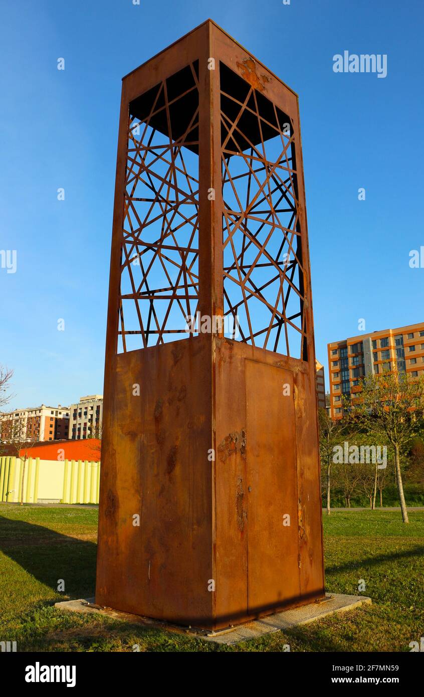 Tall box shaped sculpture made from rusting iron with lattice design in ...