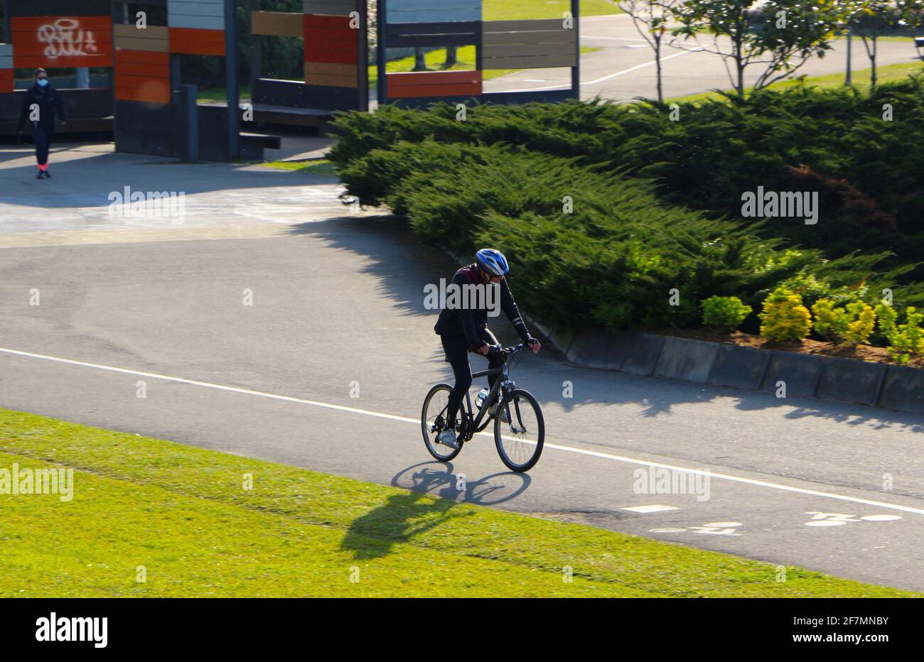 Cyclist riding a mountain bike in Las Llamas park on a sunny spring ...