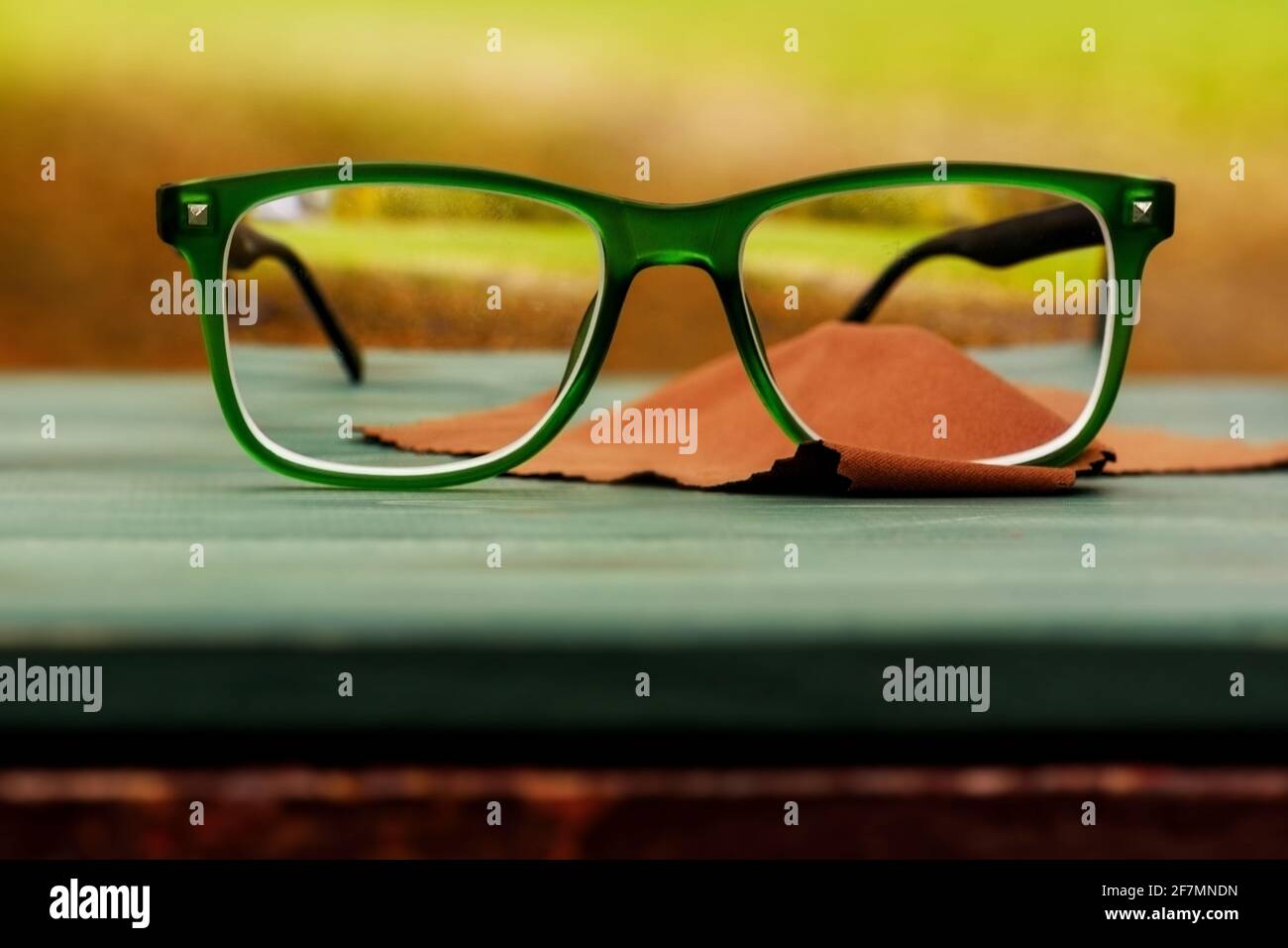 Green Rimmed Glasses. glasses green background object Stock Photo - Alamy