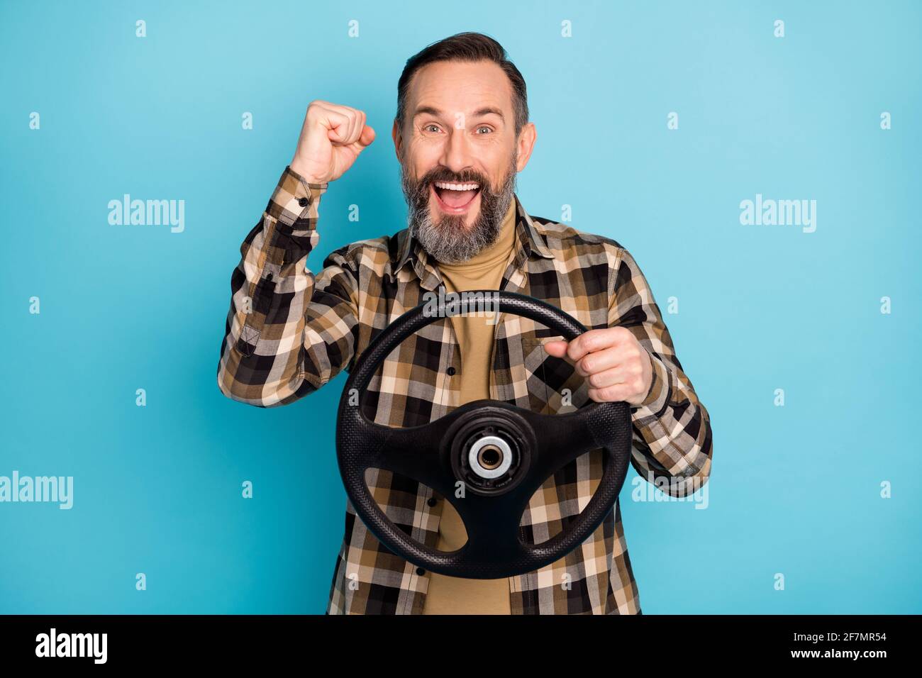 Photo portrait of man riding car keeping steering wheel gesturing like ...