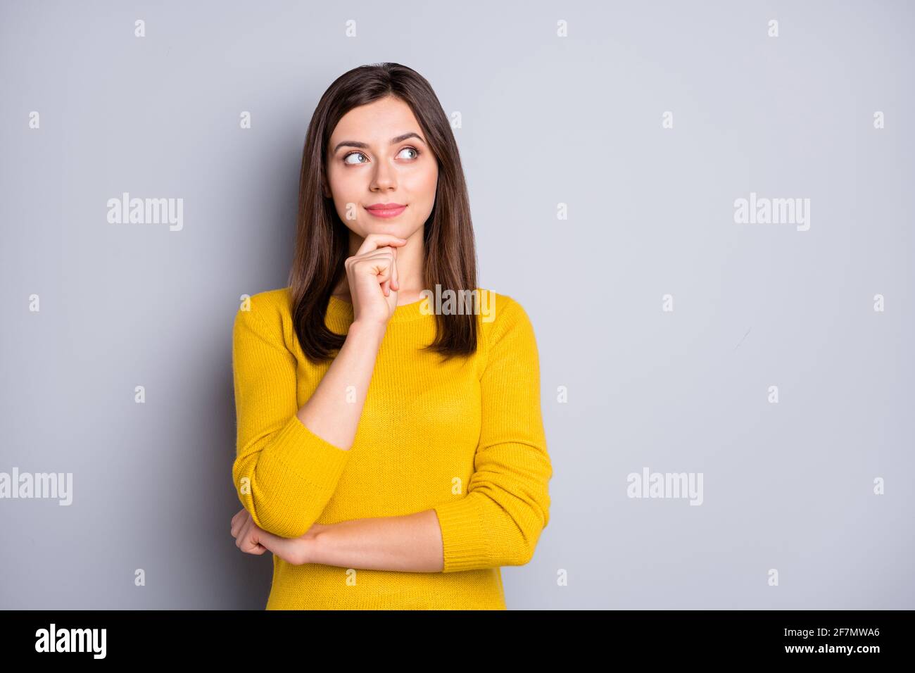 Photo of young attractive thoughtful minded pretty lovely girl thinking ...