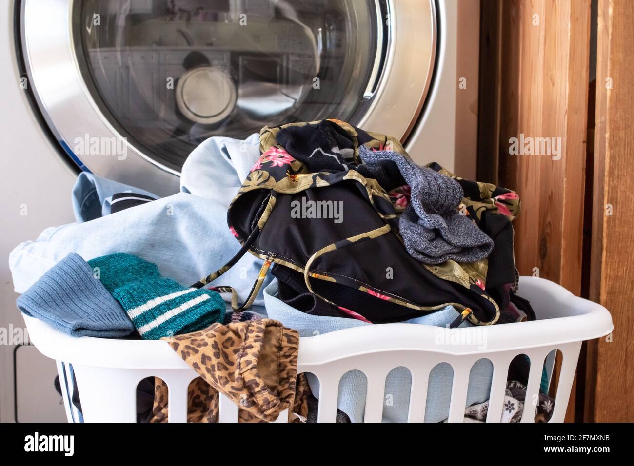 Overflowing laundry basket hi-res stock photography and images - Alamy